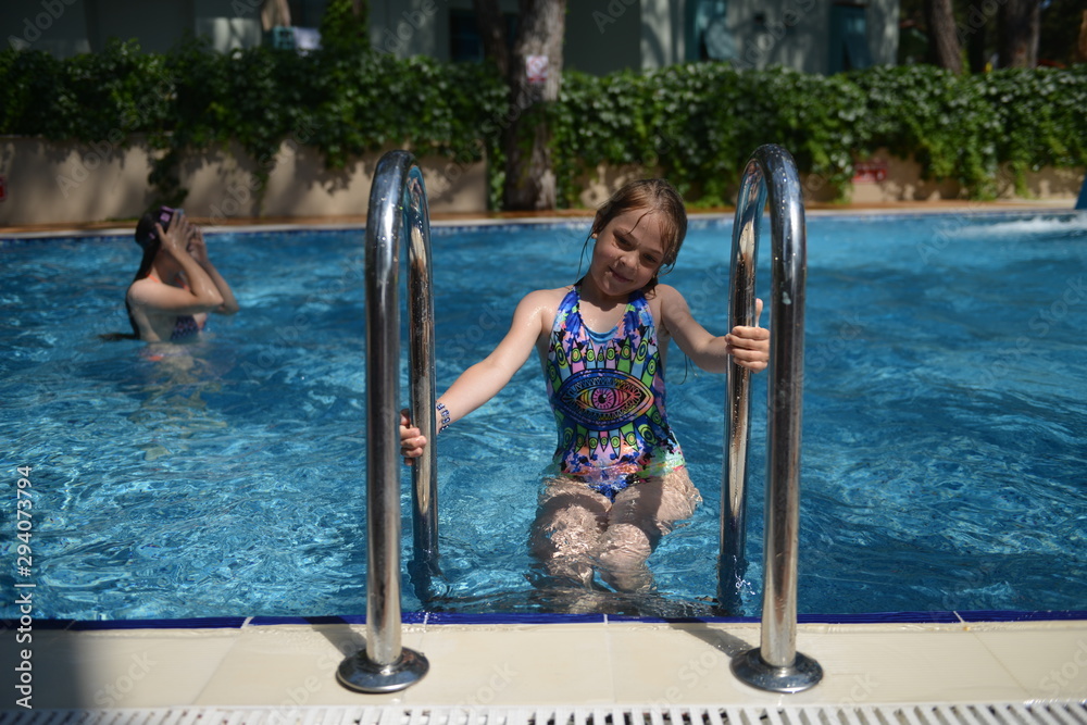 Little girl on water slide at aquapark during summer holiday Stock ...