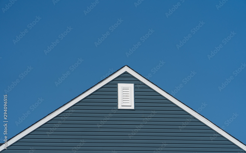Gable with blue horizontal vinyl lap siding, classic vertical surface ...