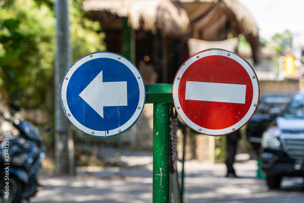 No entry and turn left sign on the street in island Bali, Indonesia ...