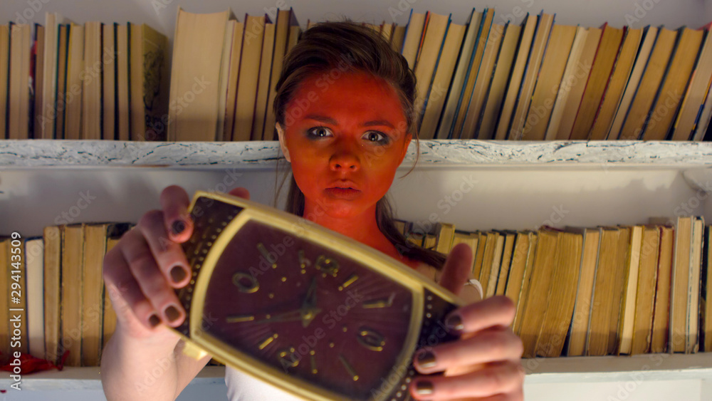 Evil woman with a red clock face shows delayed for man Stock Photo ...