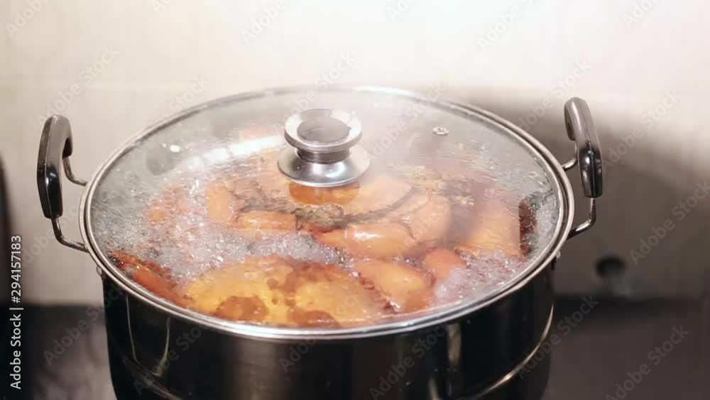 Hand open cover pot steamed crab in pot. live crabs in a pot. steaming ...