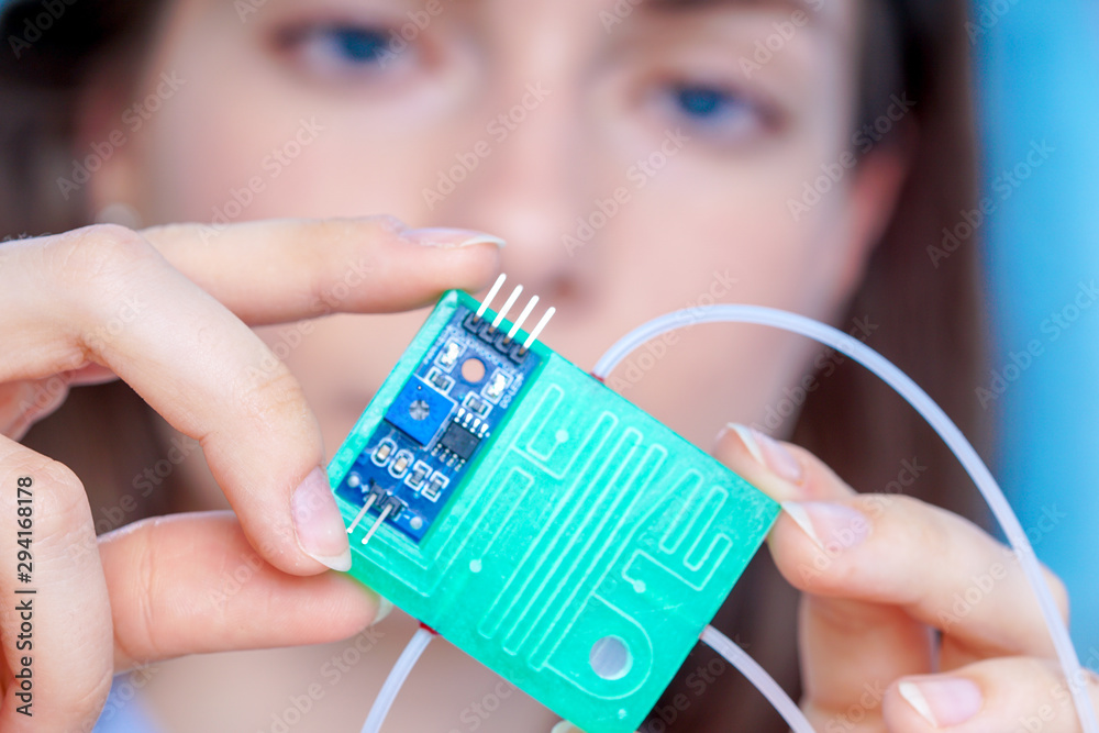 Girl holding polymers Bio-MEMS biomedical microelectromechanical ...