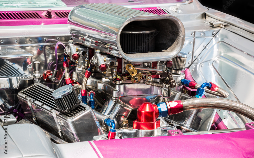 Souped up super-charged hot rod engine with pink. Stock Photo | Adobe Stock
