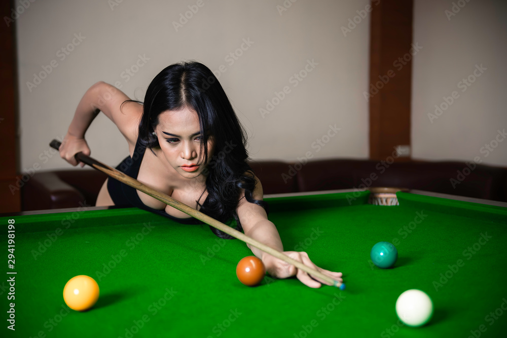 Portrait of asian sexy woman wear black one piece at snooker club,Beautiful Thailand people pose ...