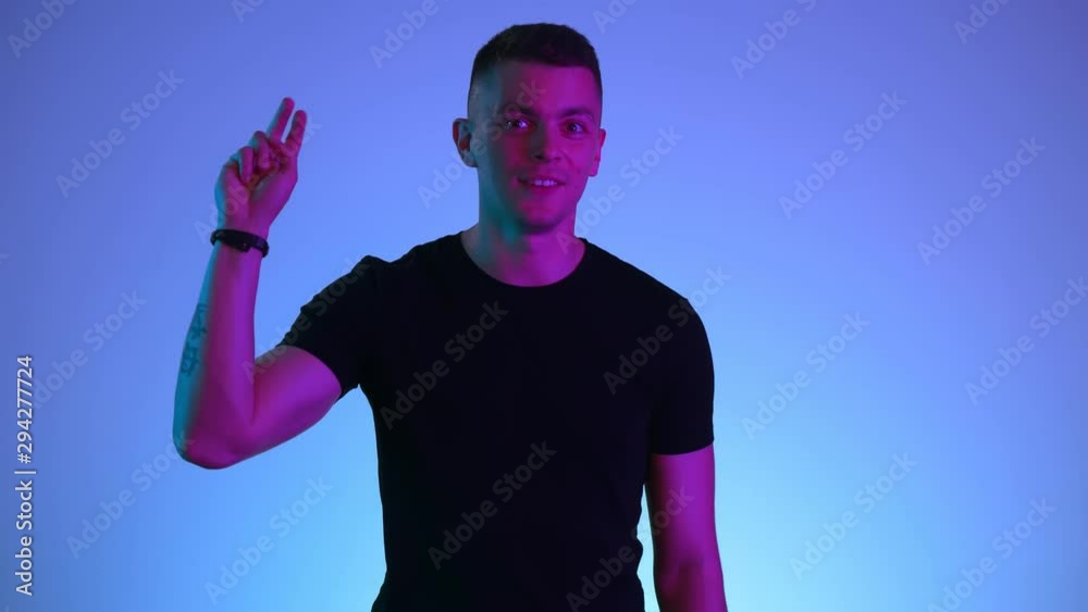 Counting from 1 to 3. Young caucasian man shows one, two, three fingers ...