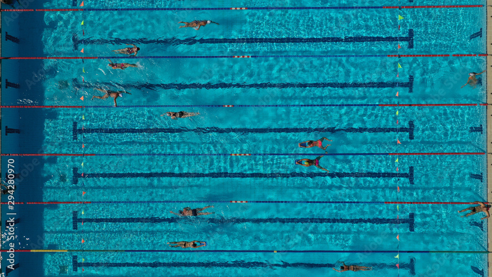 Aerial top view photo of people swimming and practising in outdoor pool ...