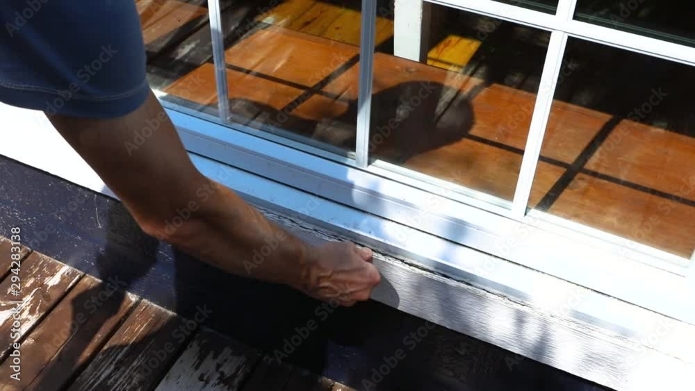 Indoor damp & air quality (IAQ) testing. A closeup view of a person ...