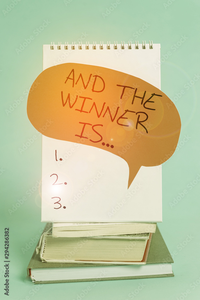 Writing note showing And The Winner Is. Business concept for announcing ...