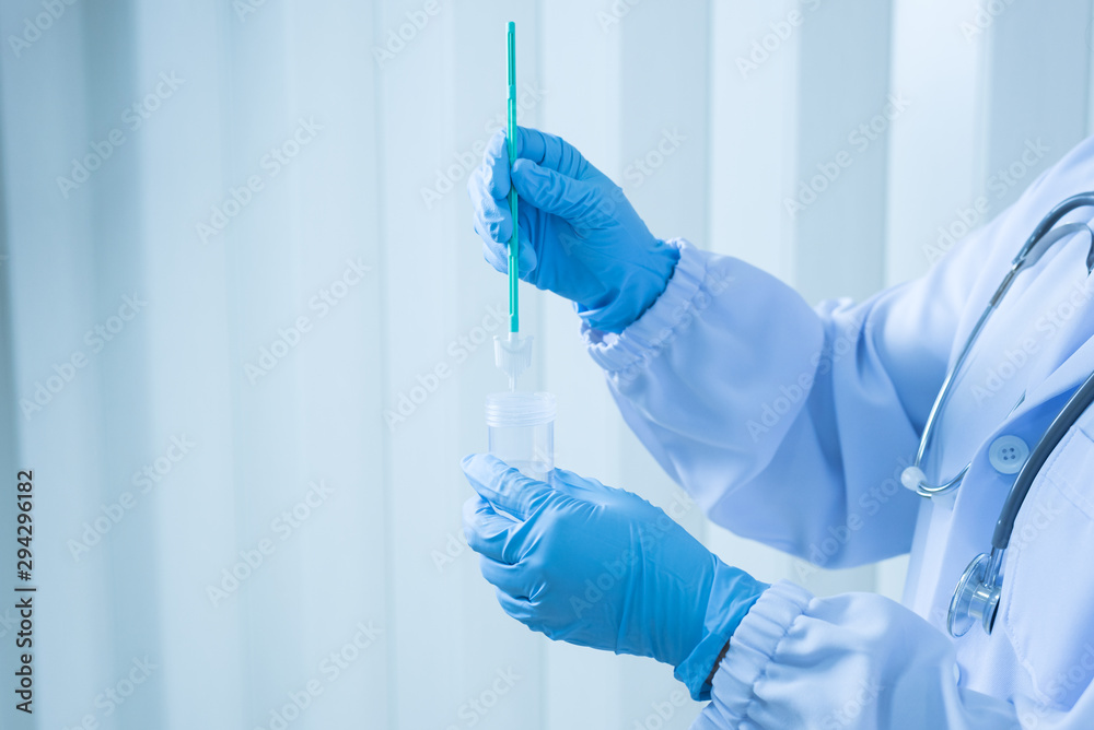 Doctor hand holding liquid base cytology set on blue background ...