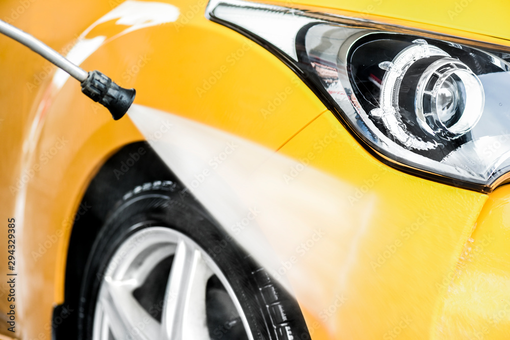 Car washing at car wash station. Water high pressure cleaning. Water ...