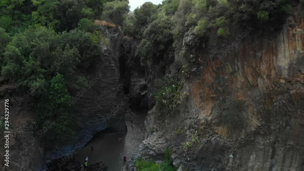 4K AERIAL DOLLY OUT: Drone rising above Alcantara Gorges, an impressive ...