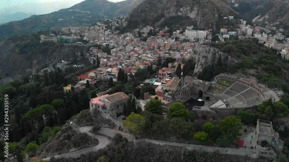 AERIAL: Drone descending above the ancient theatre of Taormina Sicily ...