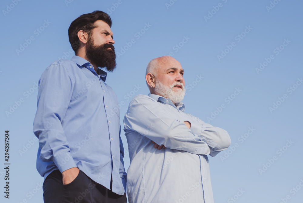 Elderly Senior man and bearded son - two generation concept. Generation ...