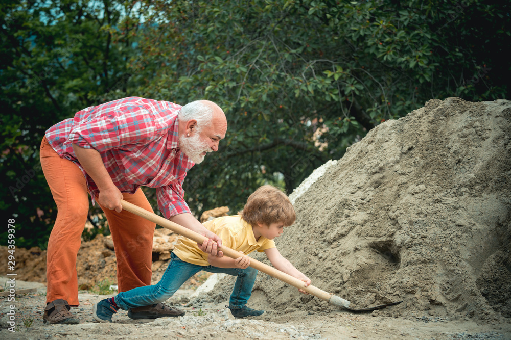 Future worker grandson with grandfather. Little grandson helping his ...
