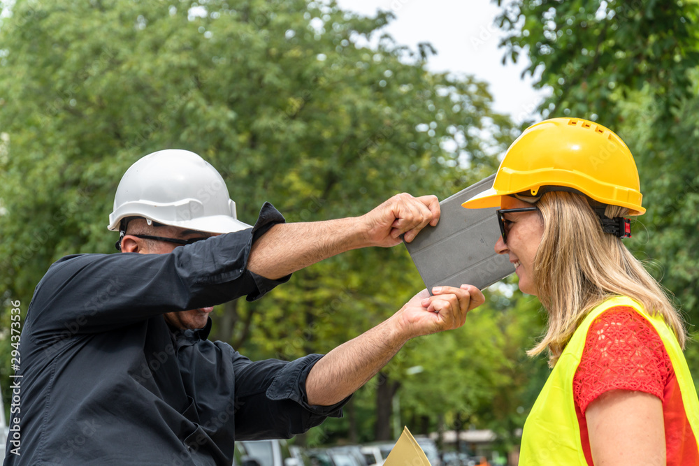 Conflict and disagreement at work on construction site. Angry ...