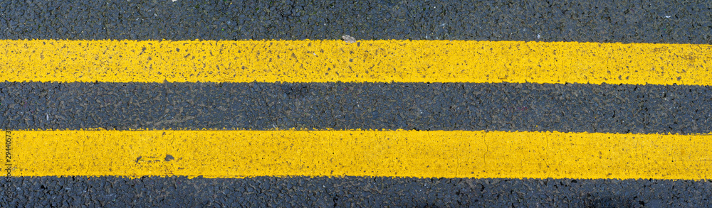 Double yellow lines on tarmac road for graphic resource Stock Photo ...