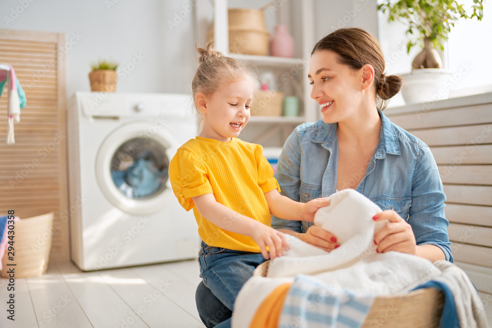 family doing laundry Stock Photo | Adobe Stock