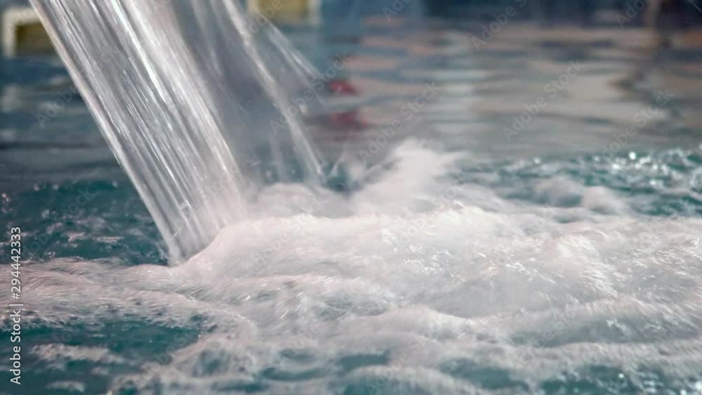 Vidéo Stock Water splashing into the pool from waterfall jet, water jet ...