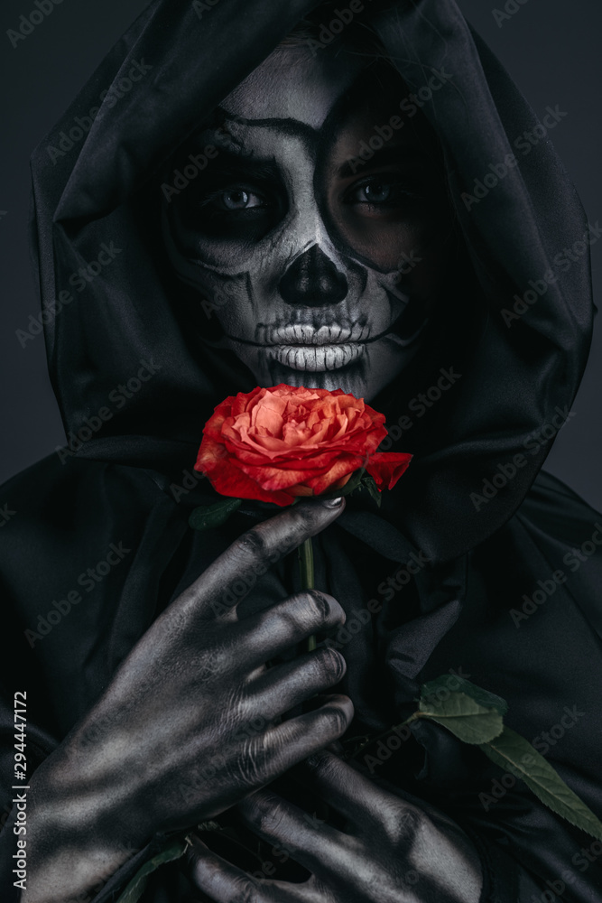 Female death with red flower Stock Photo | Adobe Stock