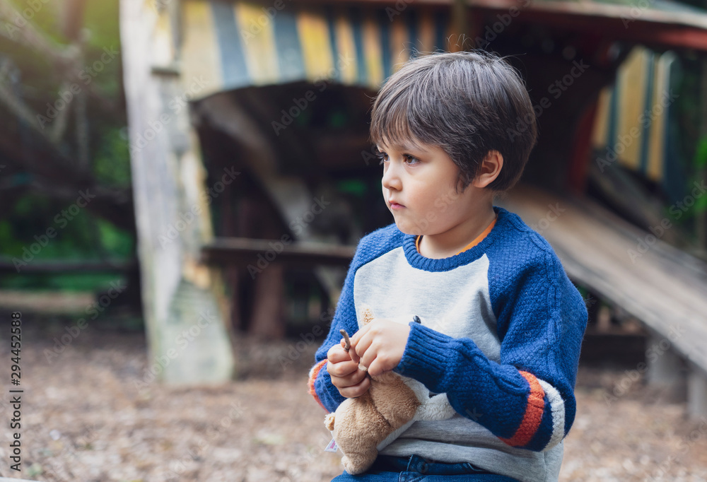 Sad Child Playing Alone