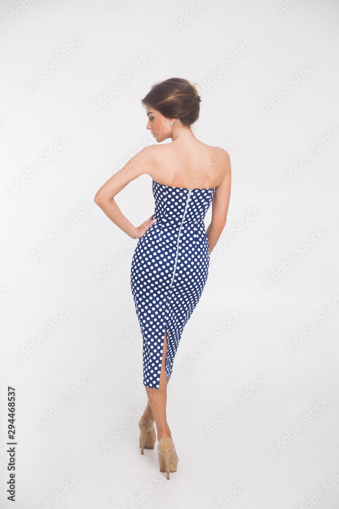 Beautiful elegant young woman with fashion hairstyle and makeup posing ...