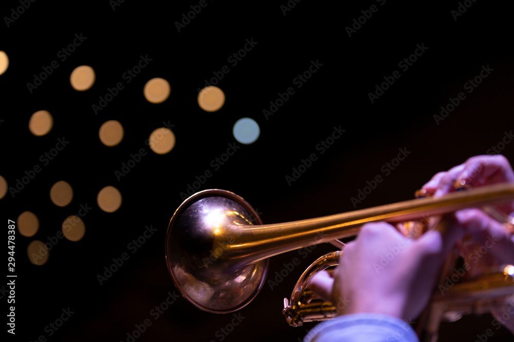 Poster A trumpet player playing on a gold plated matte lacquered ...