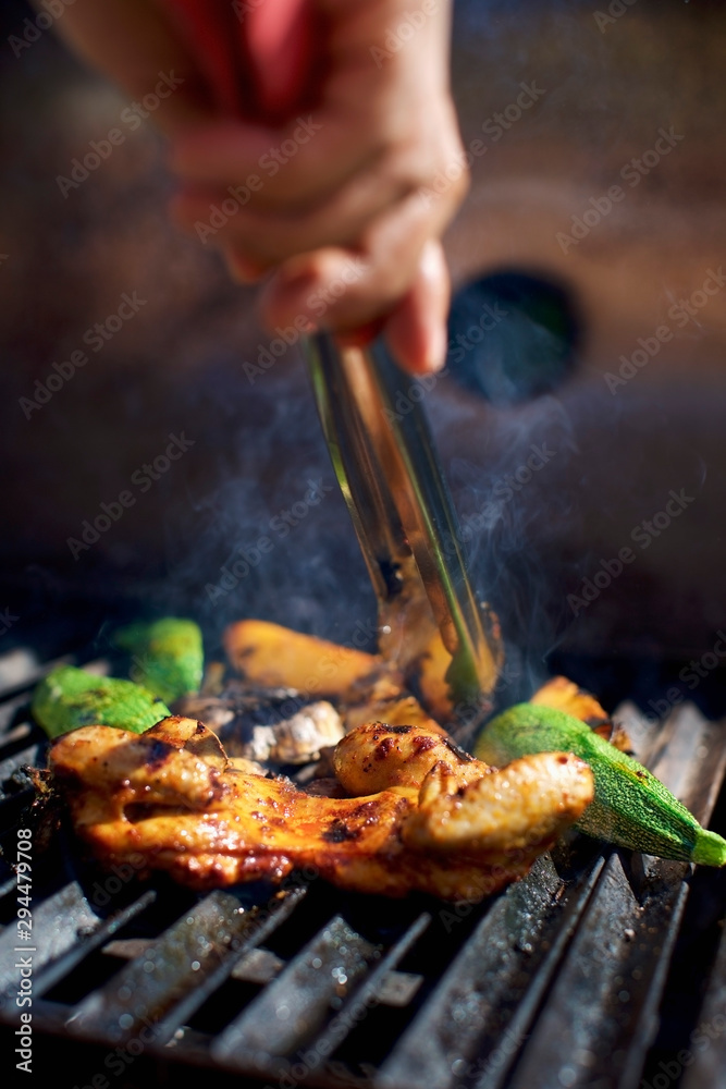 Close up chef grilling meat and vegetables on grill Stock Photo | Adobe ...