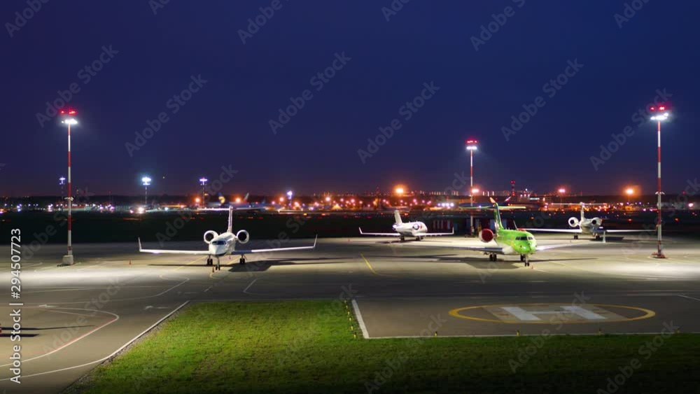 Time Lapse. Parked airplanes at the airport. Heavy aircraft traffic at ...