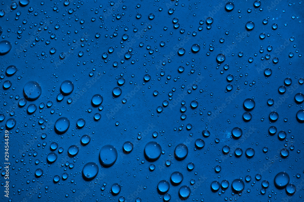 Water droplets on dark blue background Stock Photo | Adobe Stock