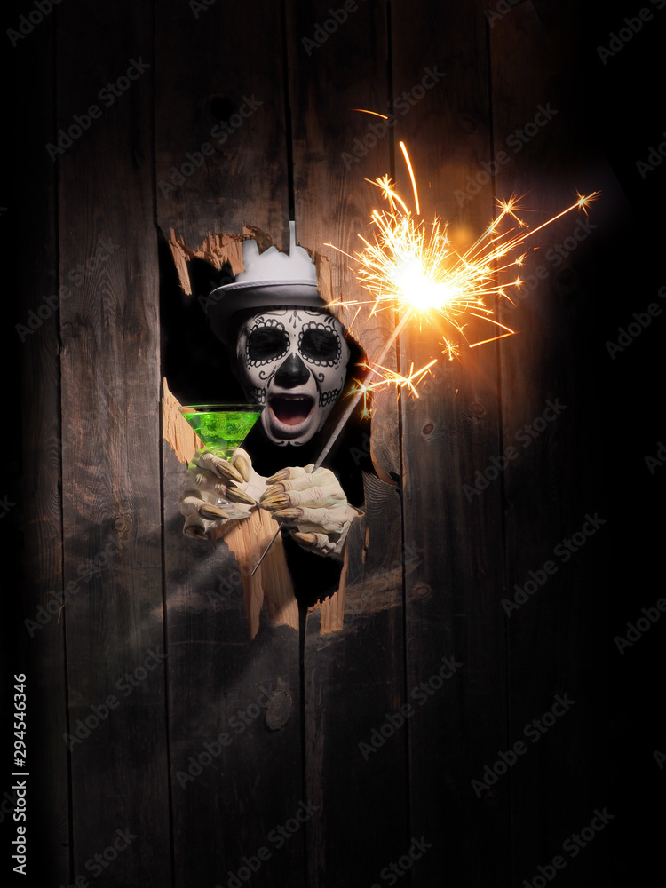 Zombie hand through hole cracked in rustic wood. Day of the dead theme ...