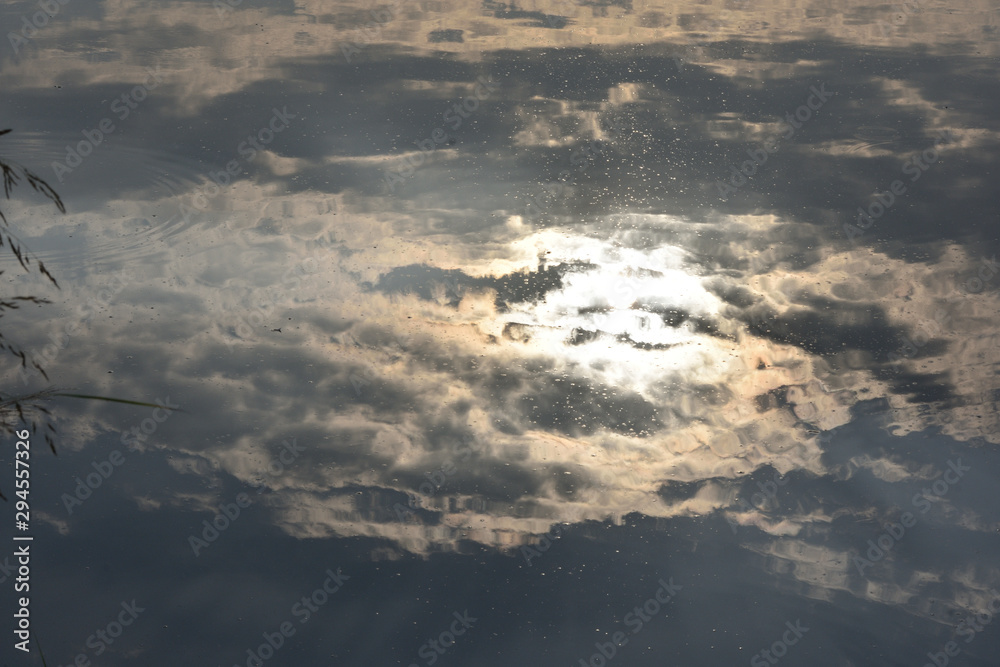 reflection of sky with clouds on water body surface Stock Photo | Adobe ...