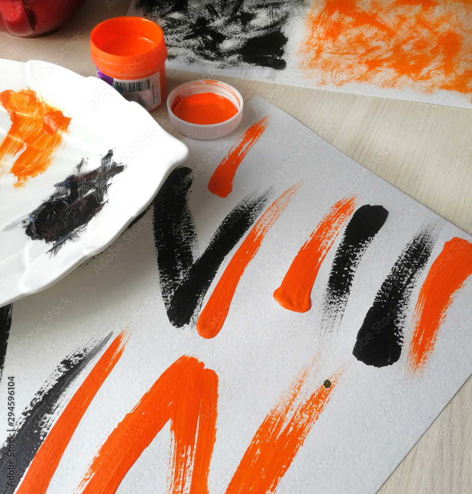 Drawing gouache brush strokes. A close-up photograph depicting a ...