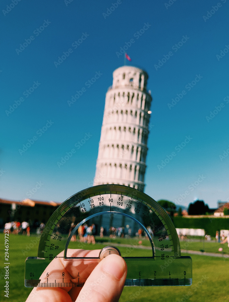 Man Using a Protractor to measure the angle of the Leaning Tower of ...