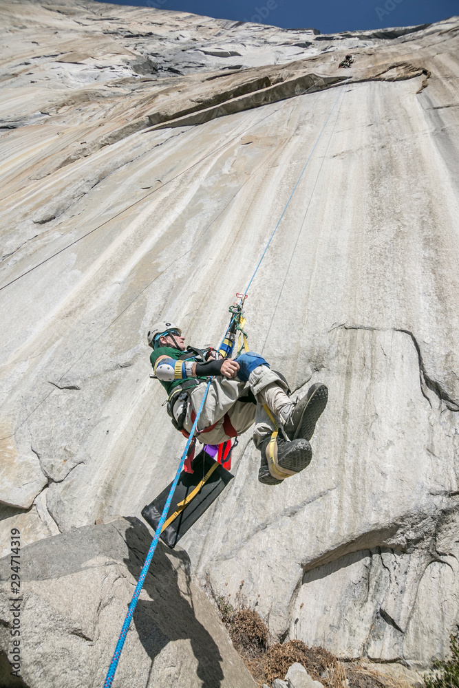Adaptive climber ascends a rope on zodiac Stock Photo | Adobe Stock