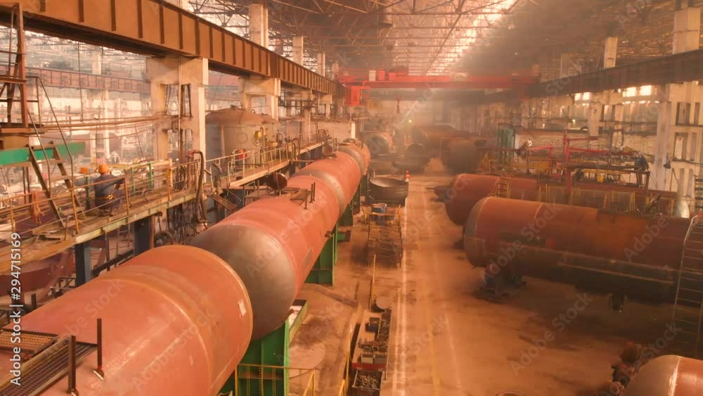 Slow flight inside the factory for manufacturing railway trains with ...