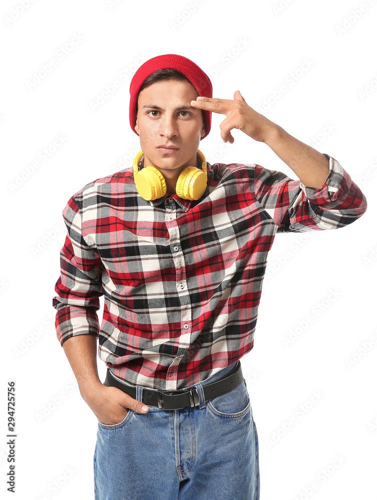 Portrait of handsome young man with headphones on white background ...
