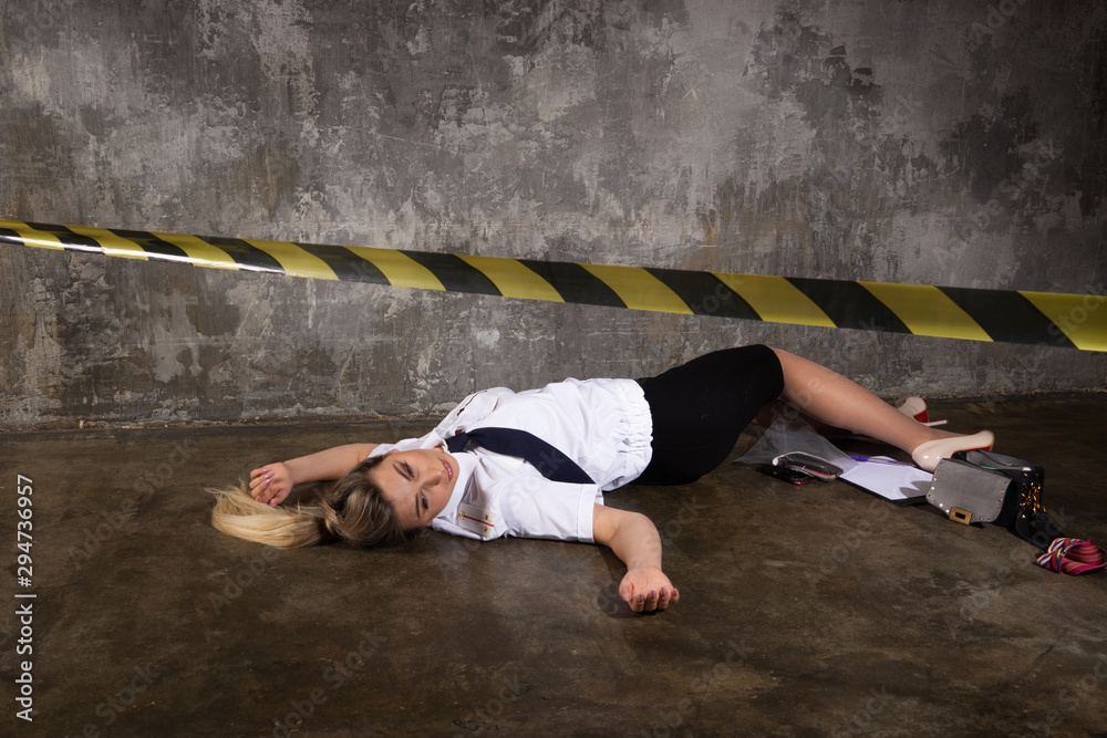 Crime scene imitation. Dead woman police officer lying on a floor ...