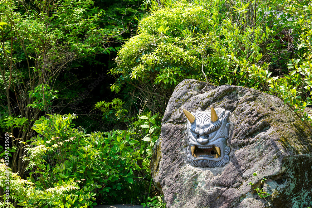 Fotografia do Stock: Japanese demon face on stone at its entrance hot ...