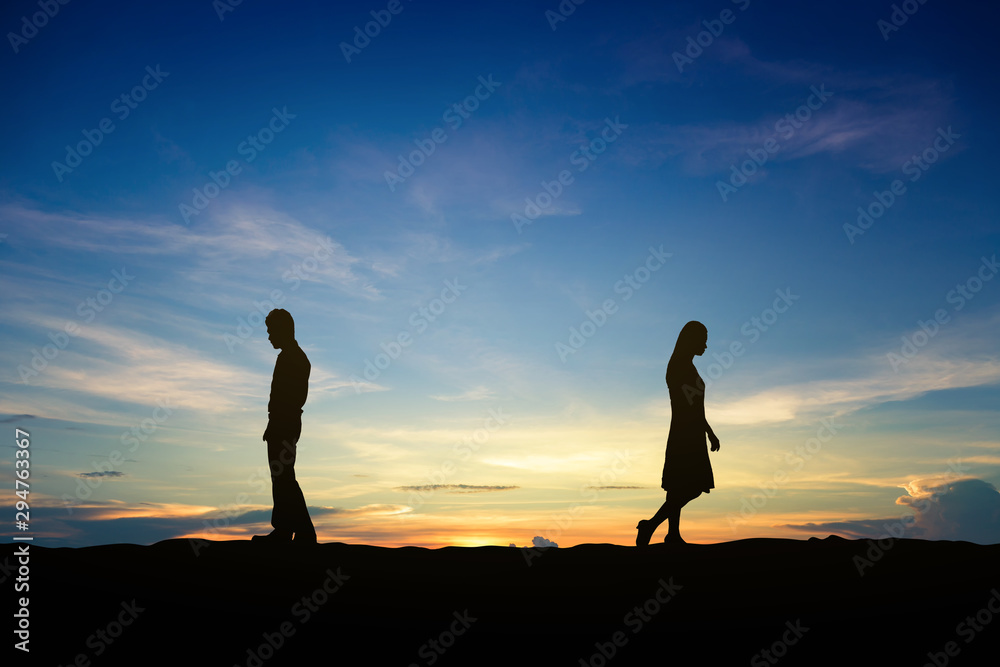 Silhouettes of couple man and woman broken heart at nature sunset. Love ...