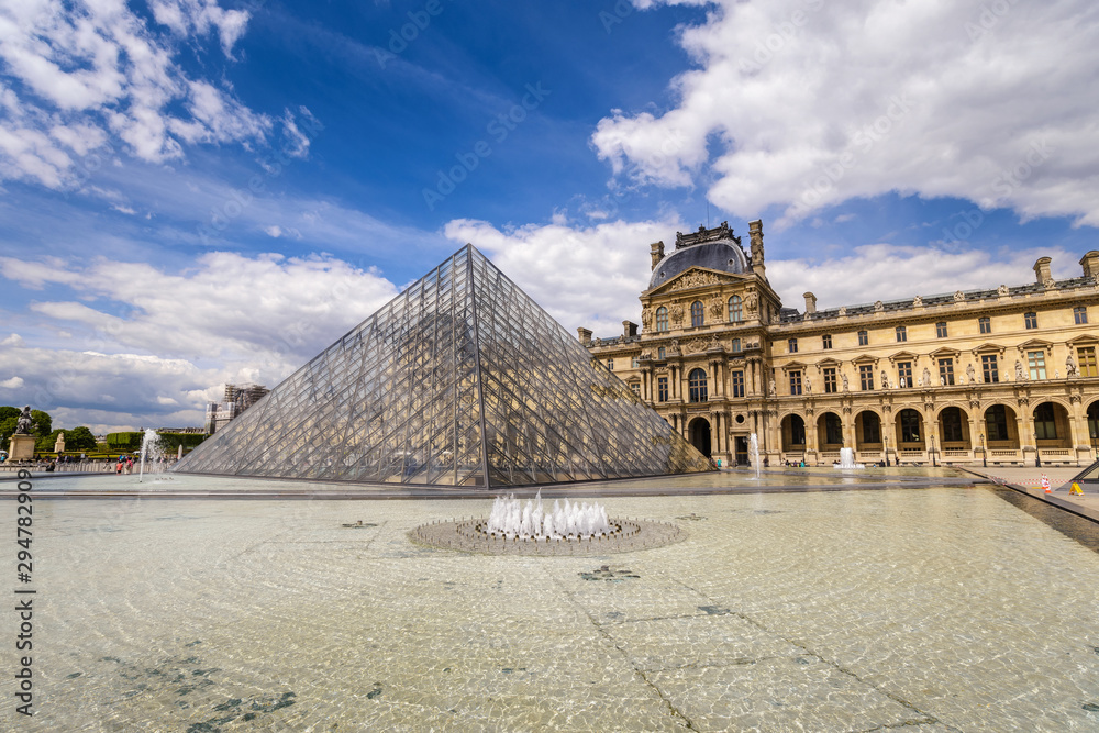 Sunny day at Louvre Pyramid of Louvre Museum in Paris, France Stock ...
