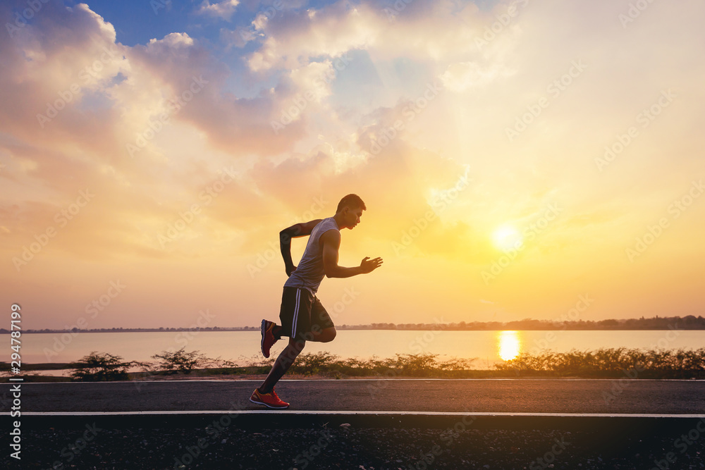 Silhouette of man running sprinting on road. Fit male fitness runner ...