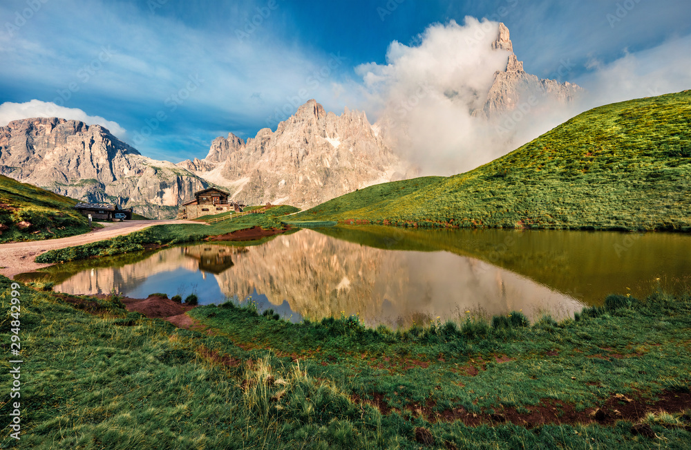 Panoramic morning view of Baita Segantini mountain refuge with Cimon ...