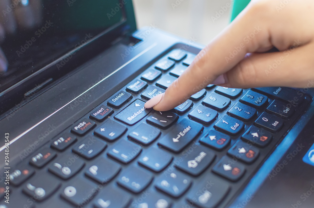 finger pushing delete button on a keyboard of computer Stock Photo ...