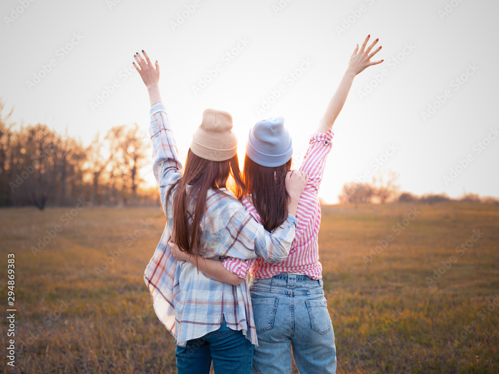 Two Best Friends Holding Hands In The Sunset