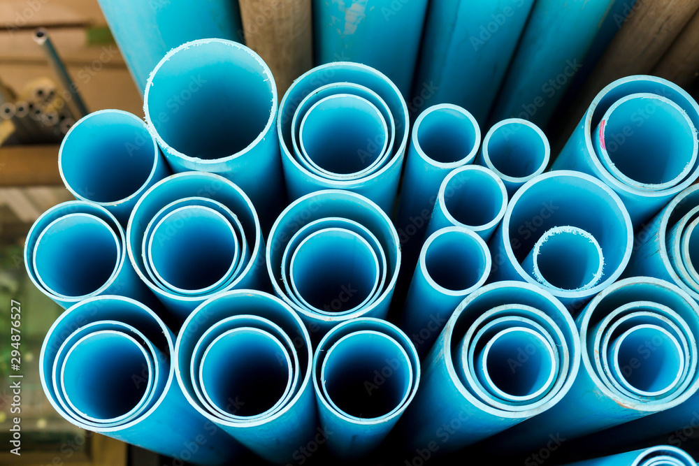 Close up to blue plastic pipe background, PVC pipes stacked in ...