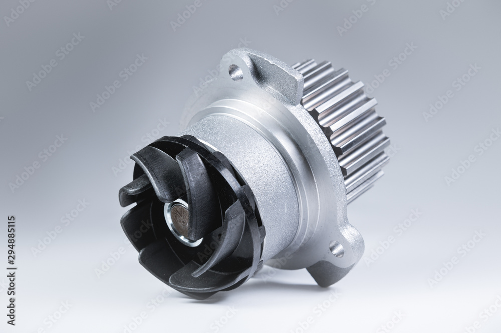 New metal automobile pump for cooling an engine water pump on a gray ...