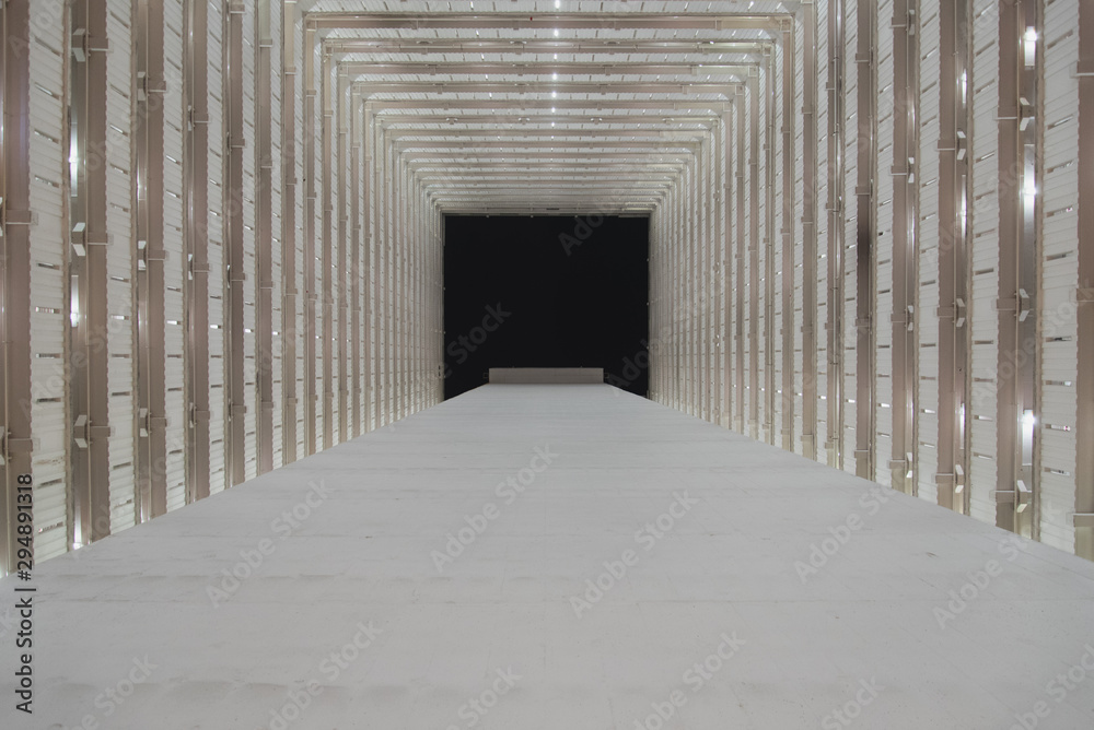 Bottoms up view of the cascading corridors opening up to a dark night ...