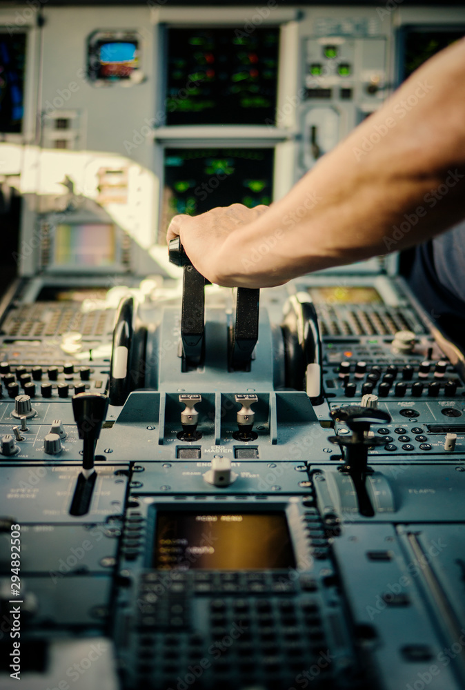 Pilot?s hand on airplane control panel Stock Photo | Adobe Stock