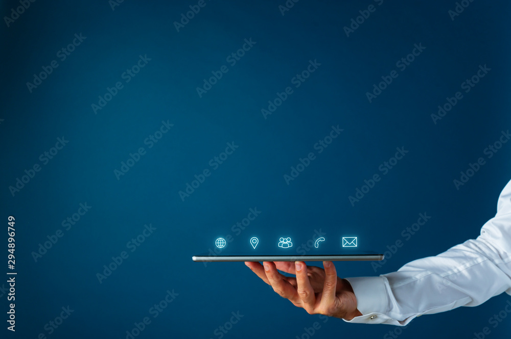 Digital tablet with glowing interface contact and information icons ...