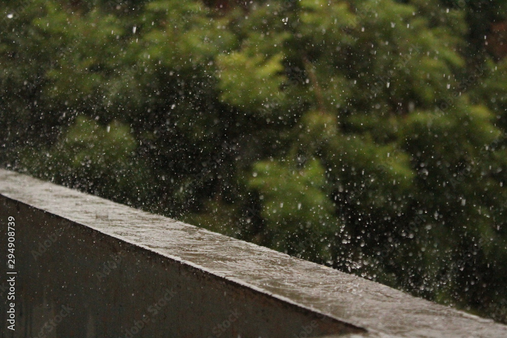 raining in the wall with rain drops Stock Photo | Adobe Stock
